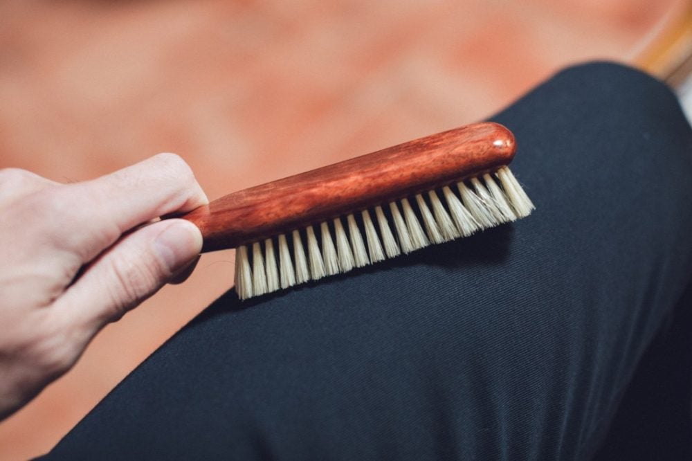 The Benefits of a Clothes Brush and How To Use One